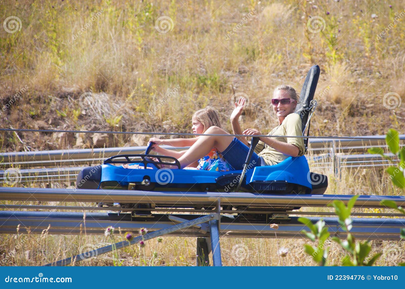 Taking a Ride on a Roller Coaster Stock Photo - Image of mother ...