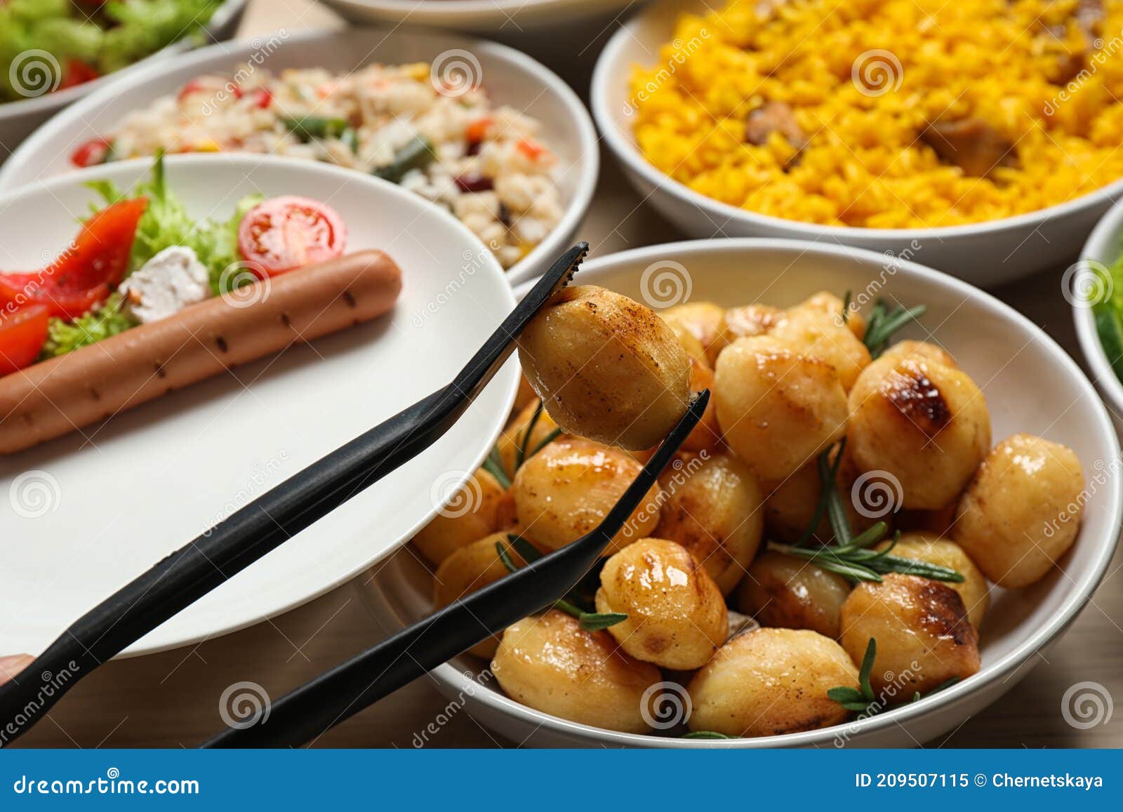Taking Roasted Potato from Buffet Table, Closeup Stock Image - Image of ...