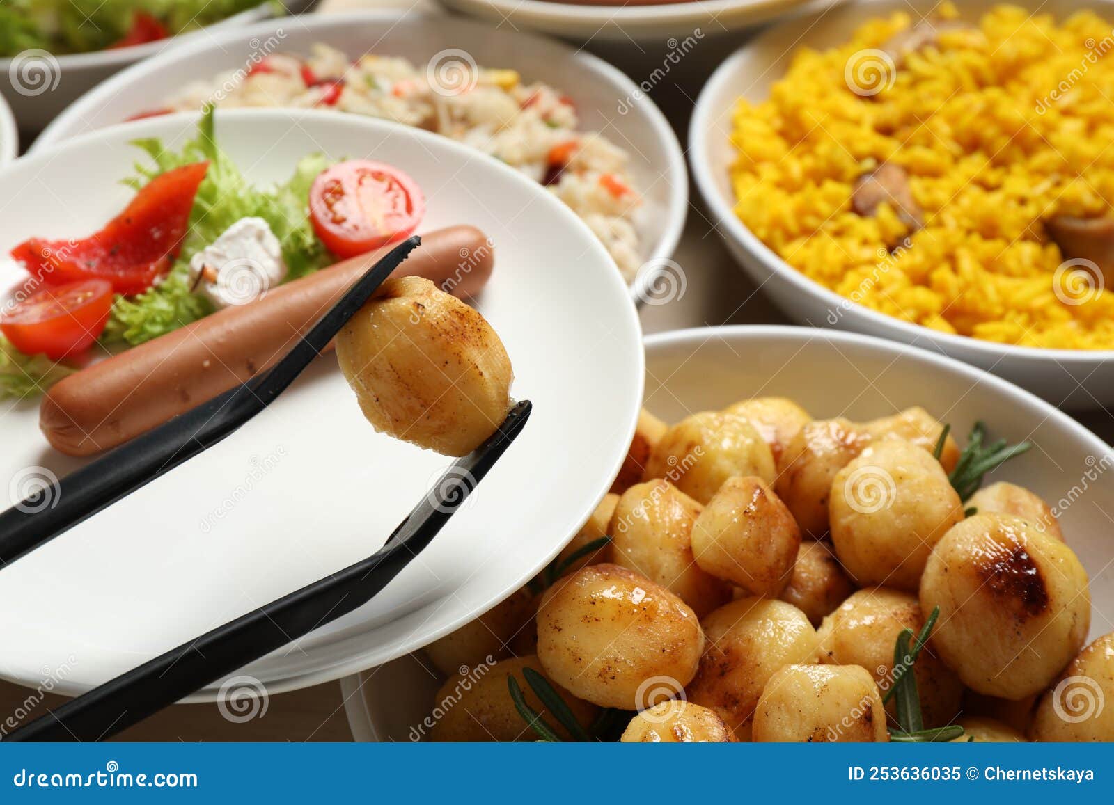 Taking Roasted Potato from Buffet Table, Closeup Stock Image - Image of ...