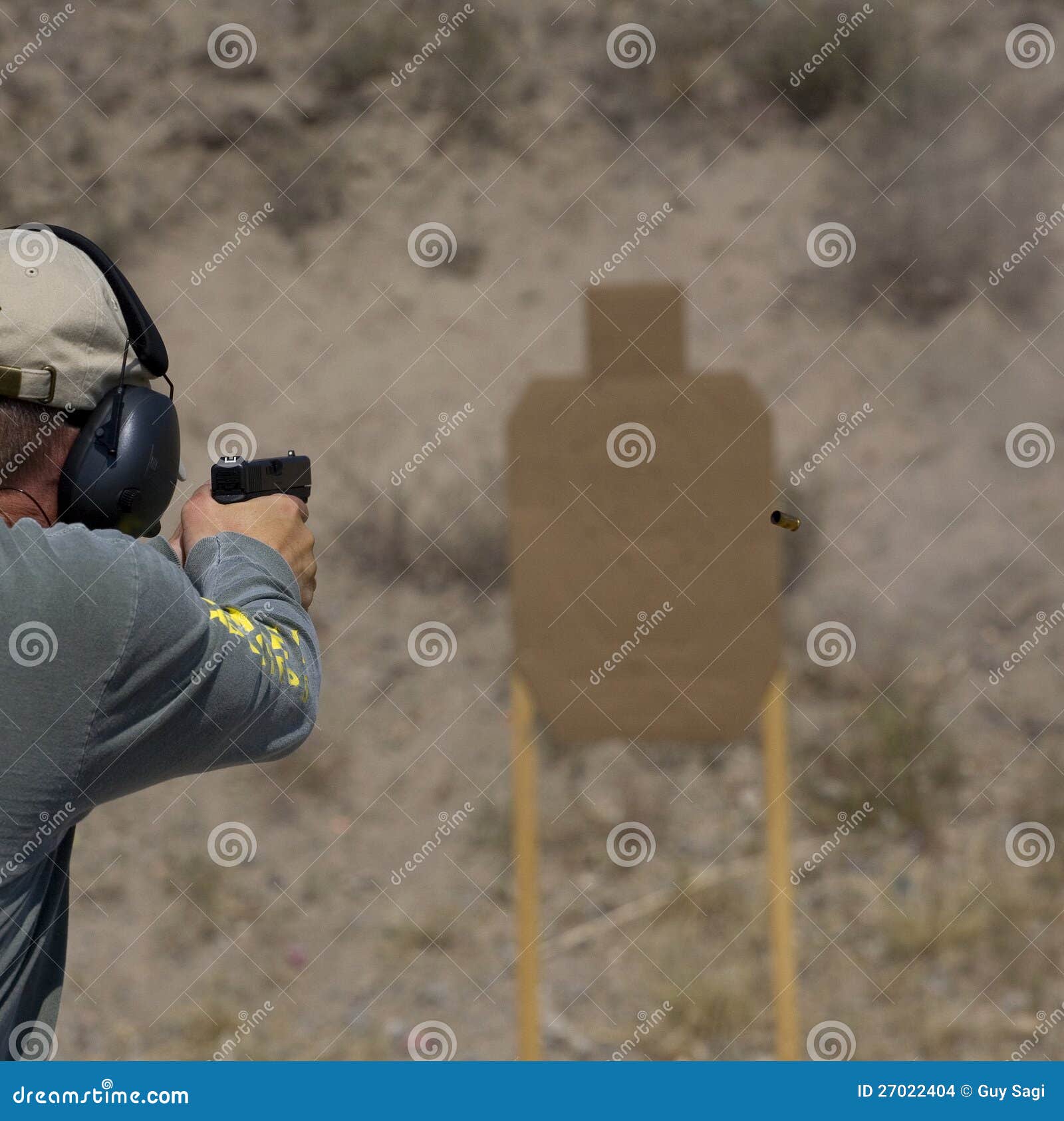 Taking a shot stock photo. Image of grey, hand, shell - 27022404