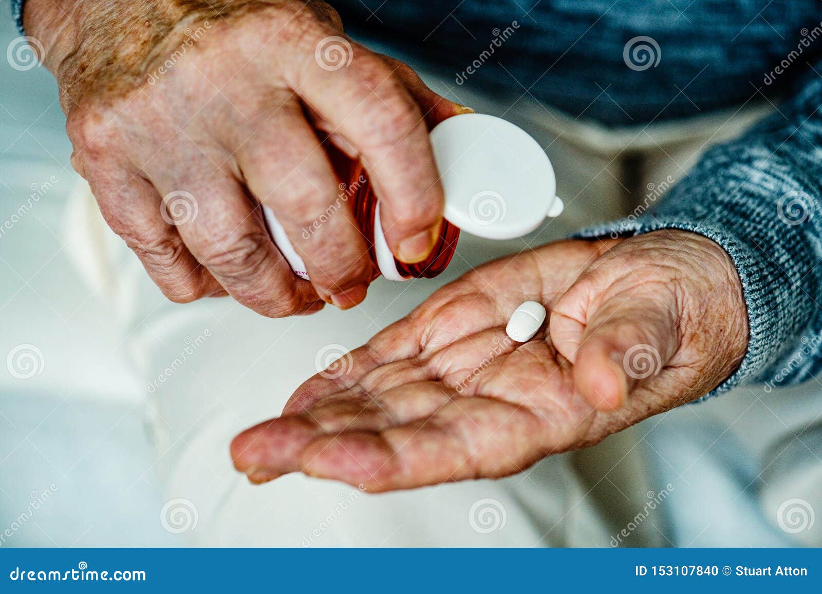 Taking a tablet stock photo. Image of hand, medical - 153107840