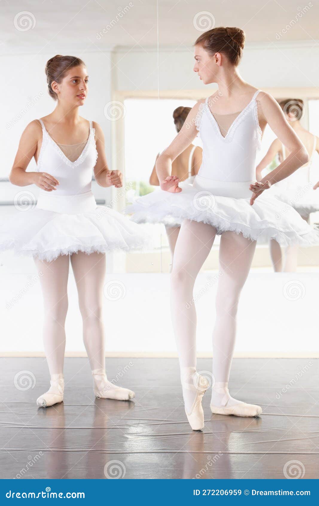 Taking Time Out for Pointers. Full Length Shot of Two Ballerinas ...