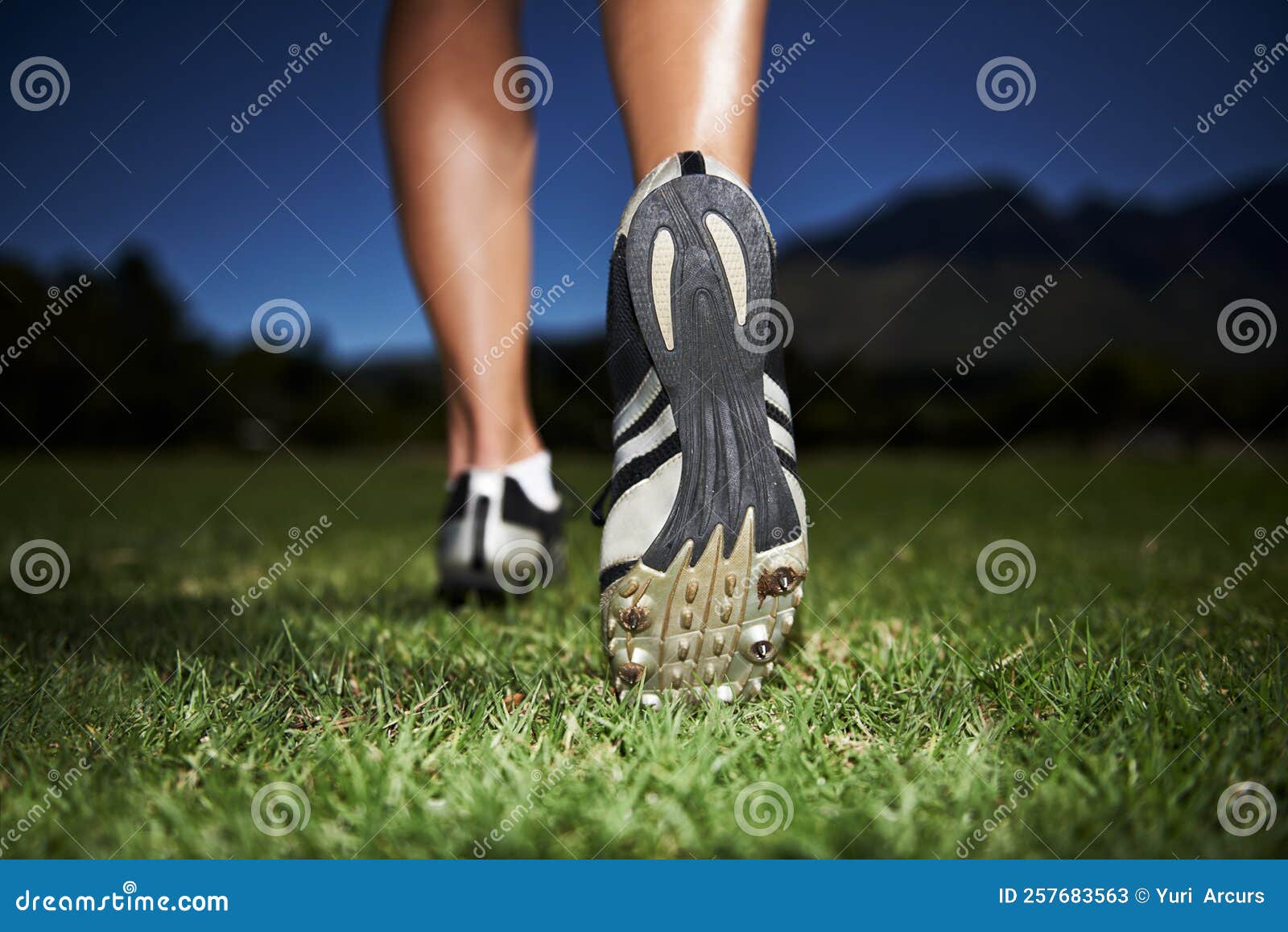 Taking on the World One Step at a Time. Closeup of a Runners Feet ...