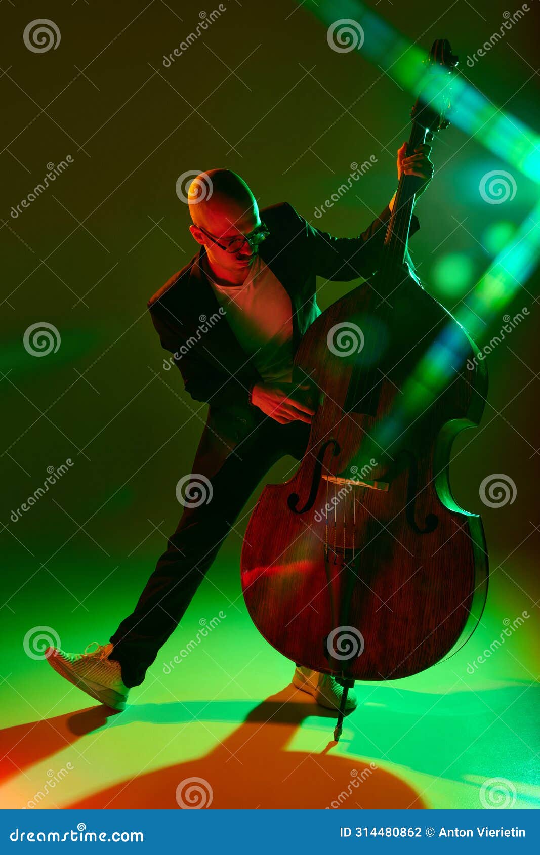 Talented Cellist Performing Jazz Compositions in Red-green Neon Light ...
