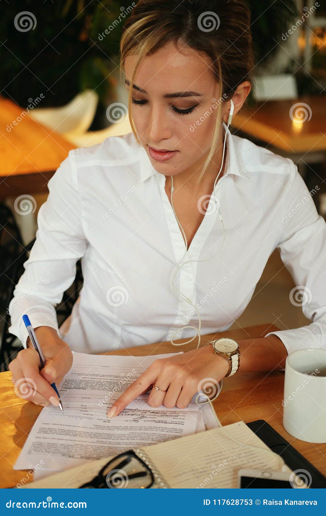 Talented Female Student Creating Article for Homework Using Textbook ...