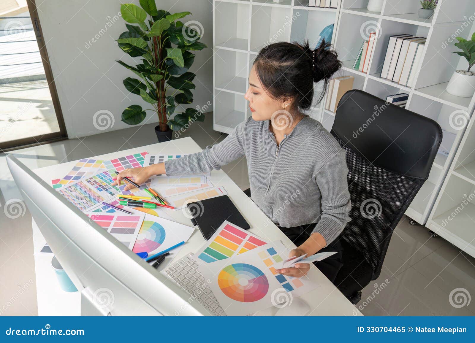 Talented Graphic Designer Working on Color Palettes and Design Projects ...