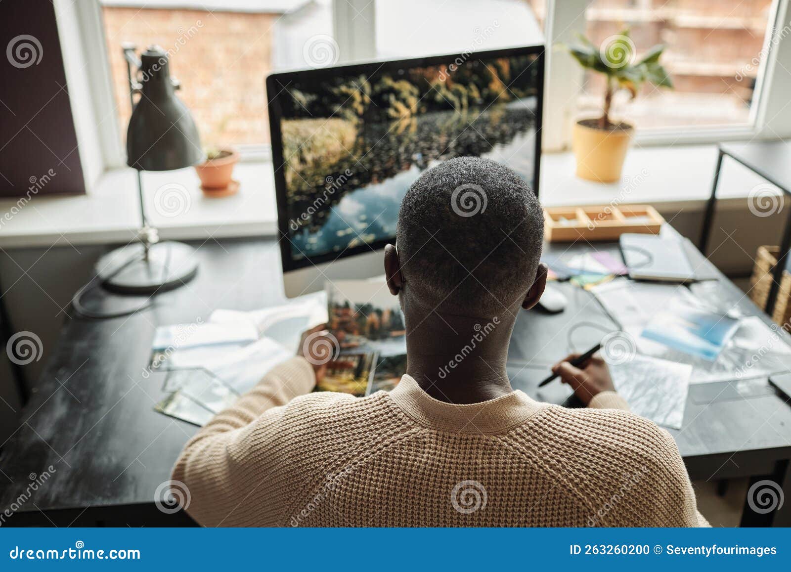 Talented Man Retouching Photos Stock Photo - Image of back ...