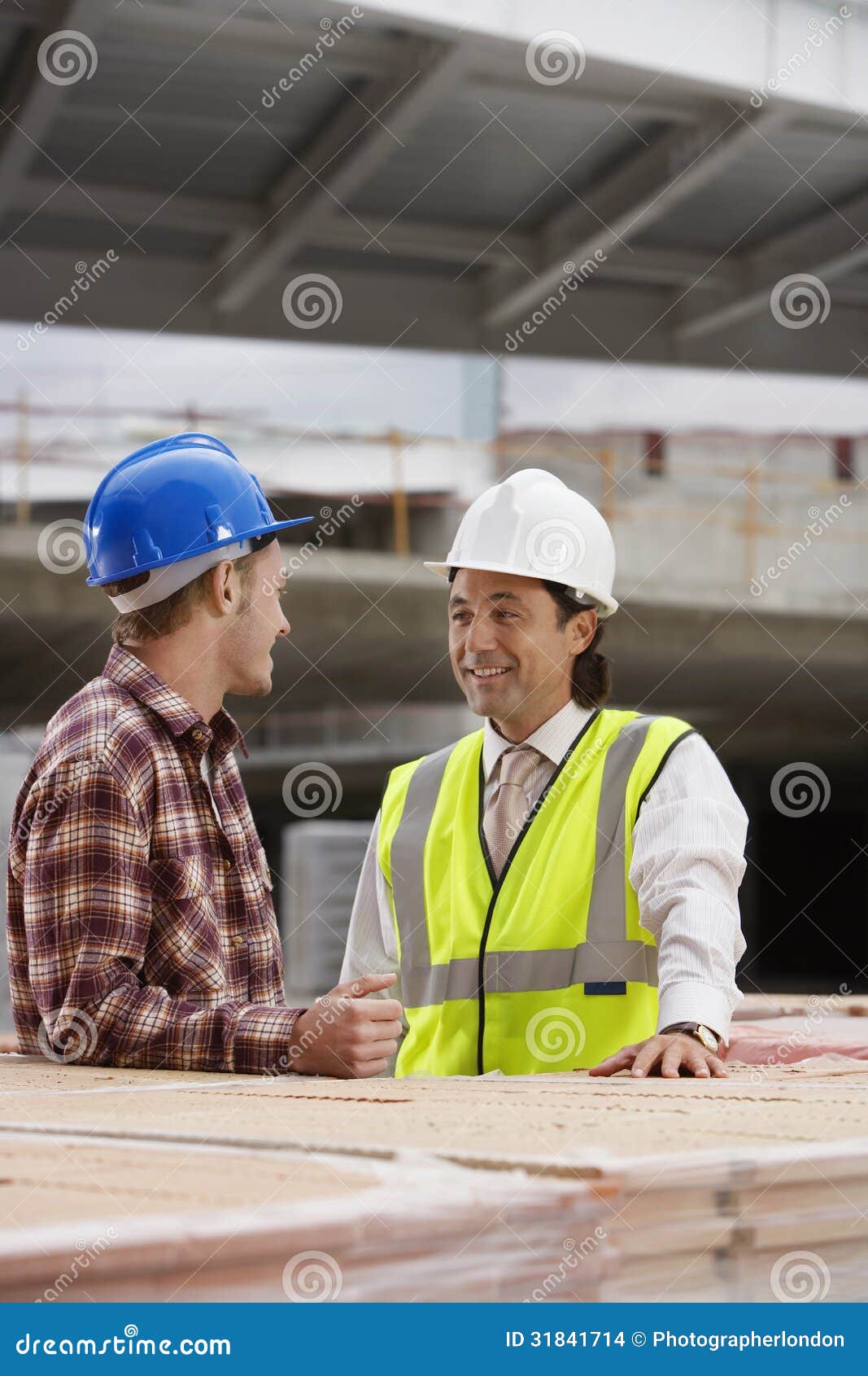Talking at Building Site stock photo. Image of contented - 31841714