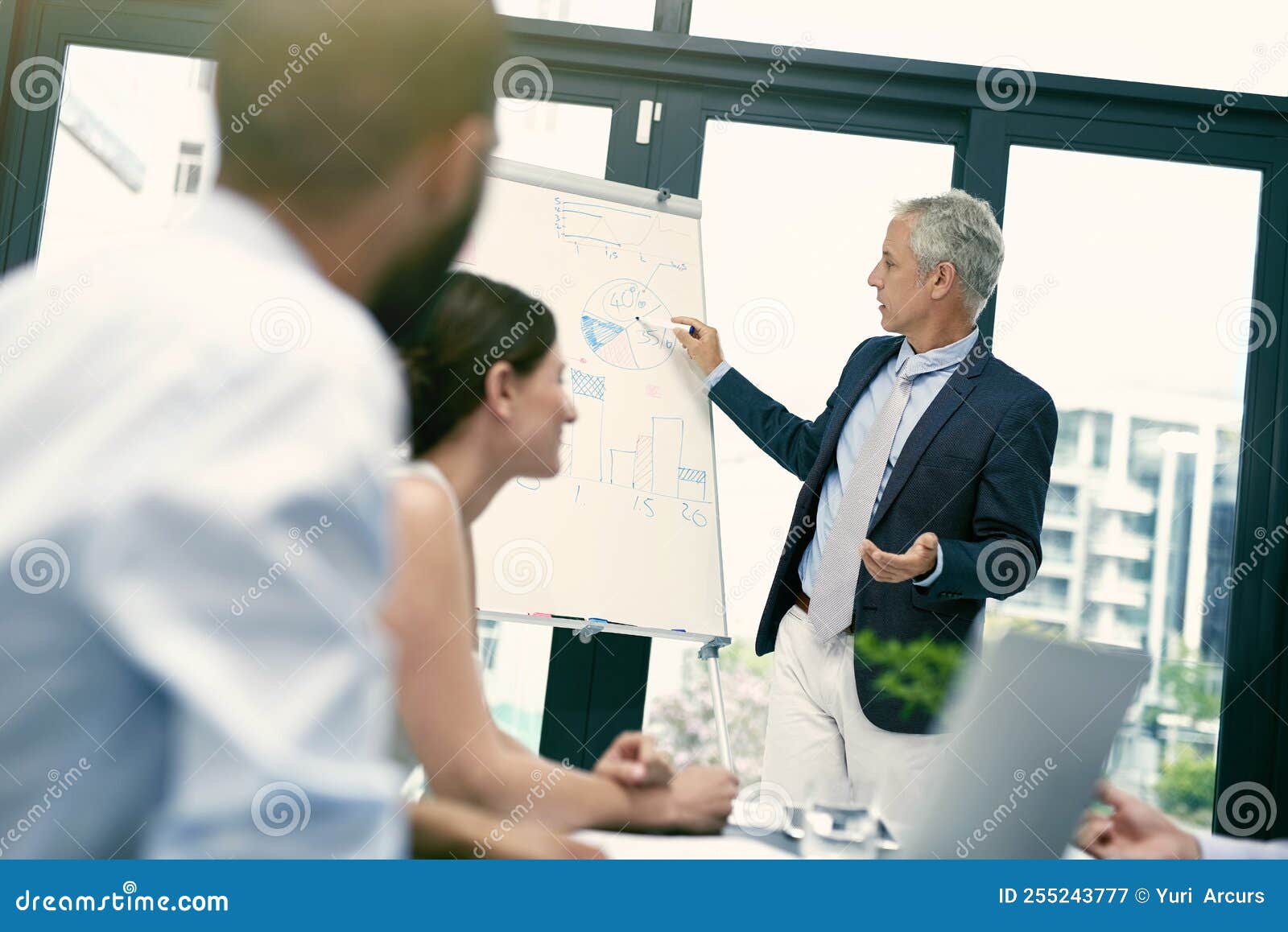 Talking Business. a Group of Businesspeople in a Presentation. Stock ...