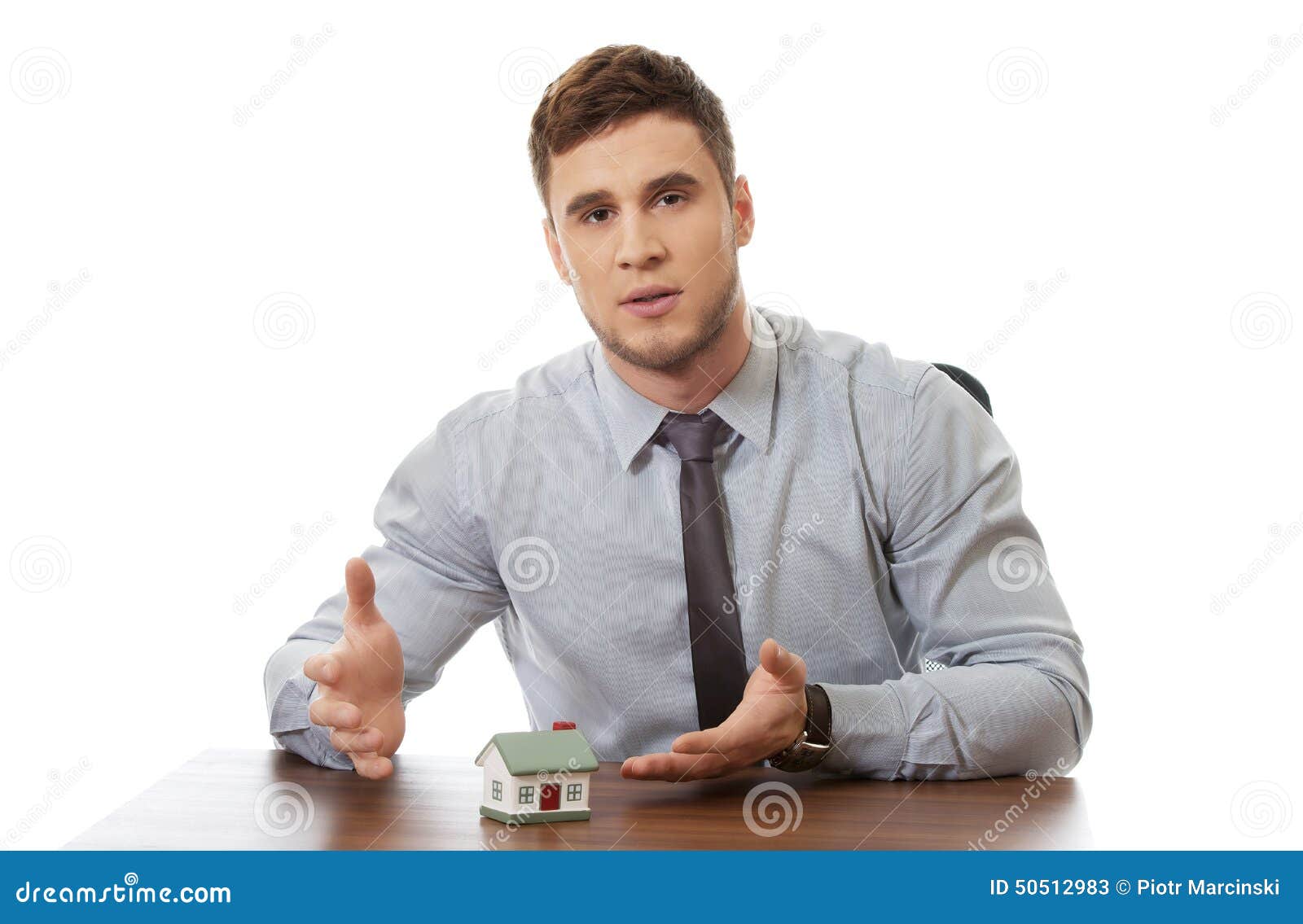 Talking Businessman with House Model by a Desk. Stock Image - Image of ...