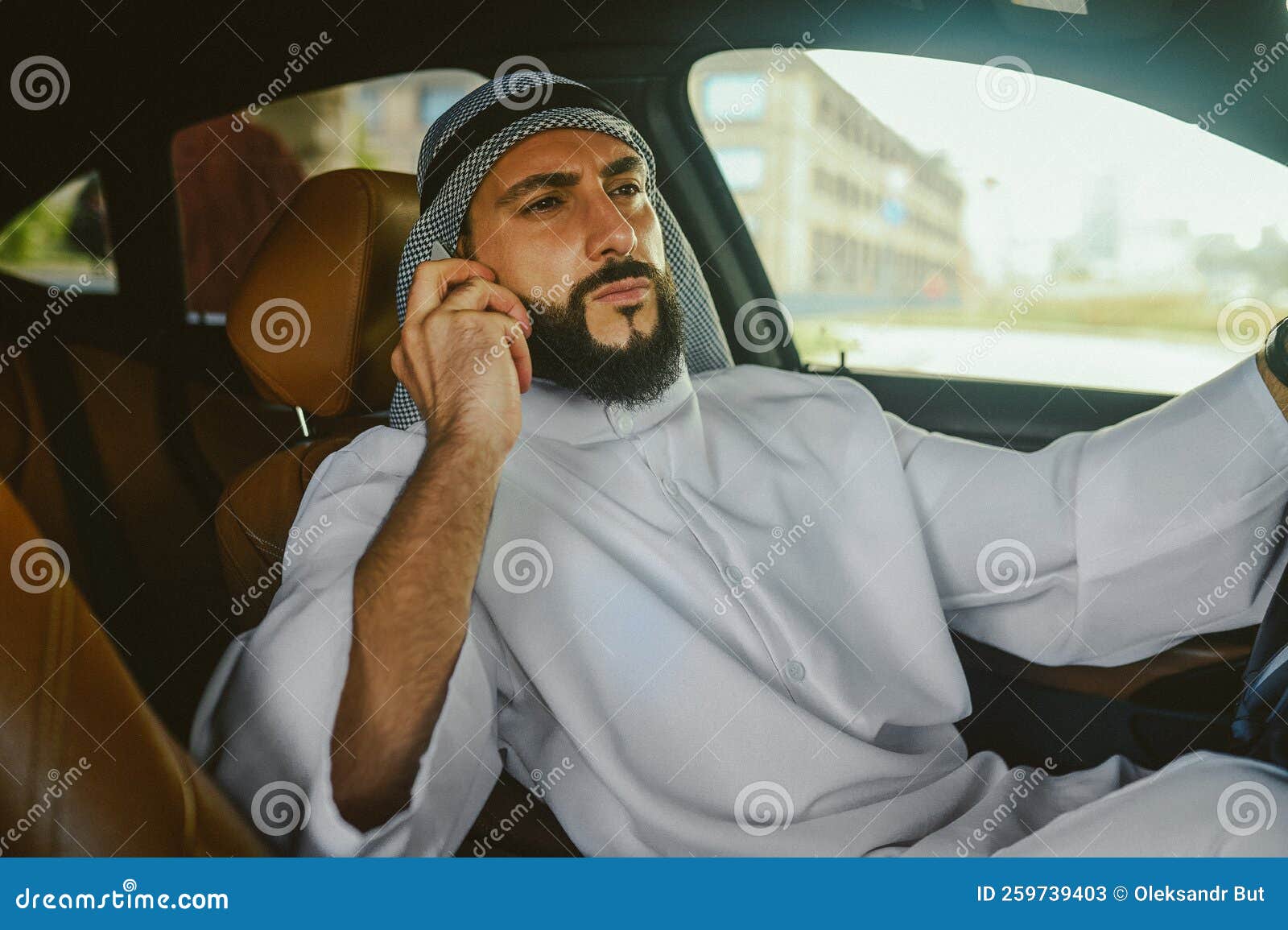 Saudi Man Sitting in a Car and Talking on the Phone Stock Image - Image ...