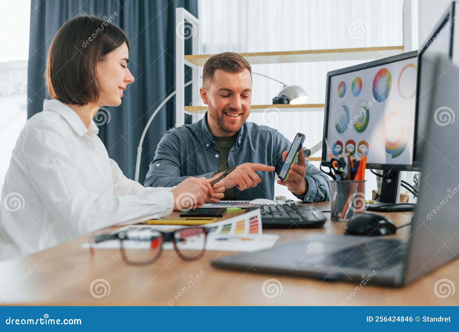 Talking and Creating Content. Two Designers Working Together in the ...