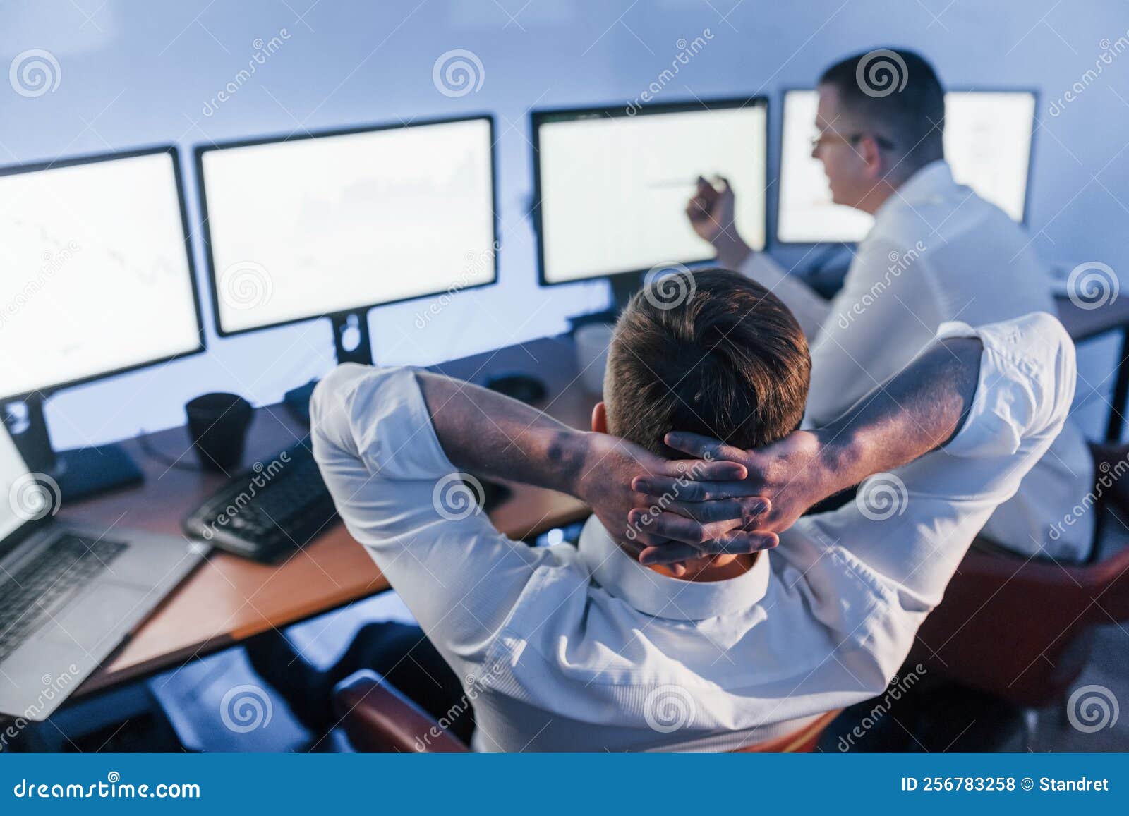 Talking with Each Other. Two Stock Traders Working in the Office with ...