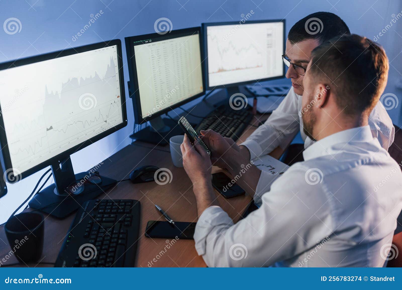 Talking with Each Other. Two Stock Traders Working in the Office with ...