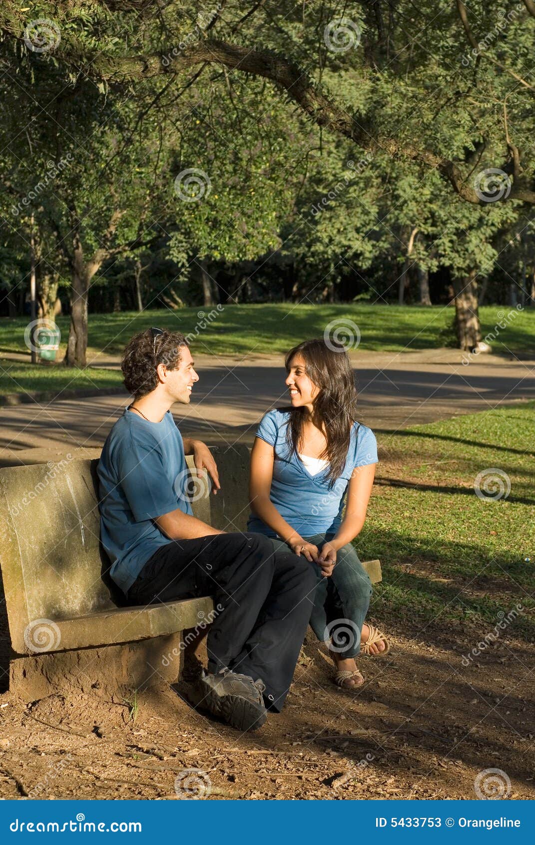 Talking on a Park Bench-Vertical Stock Image - Image of mixed, female ...