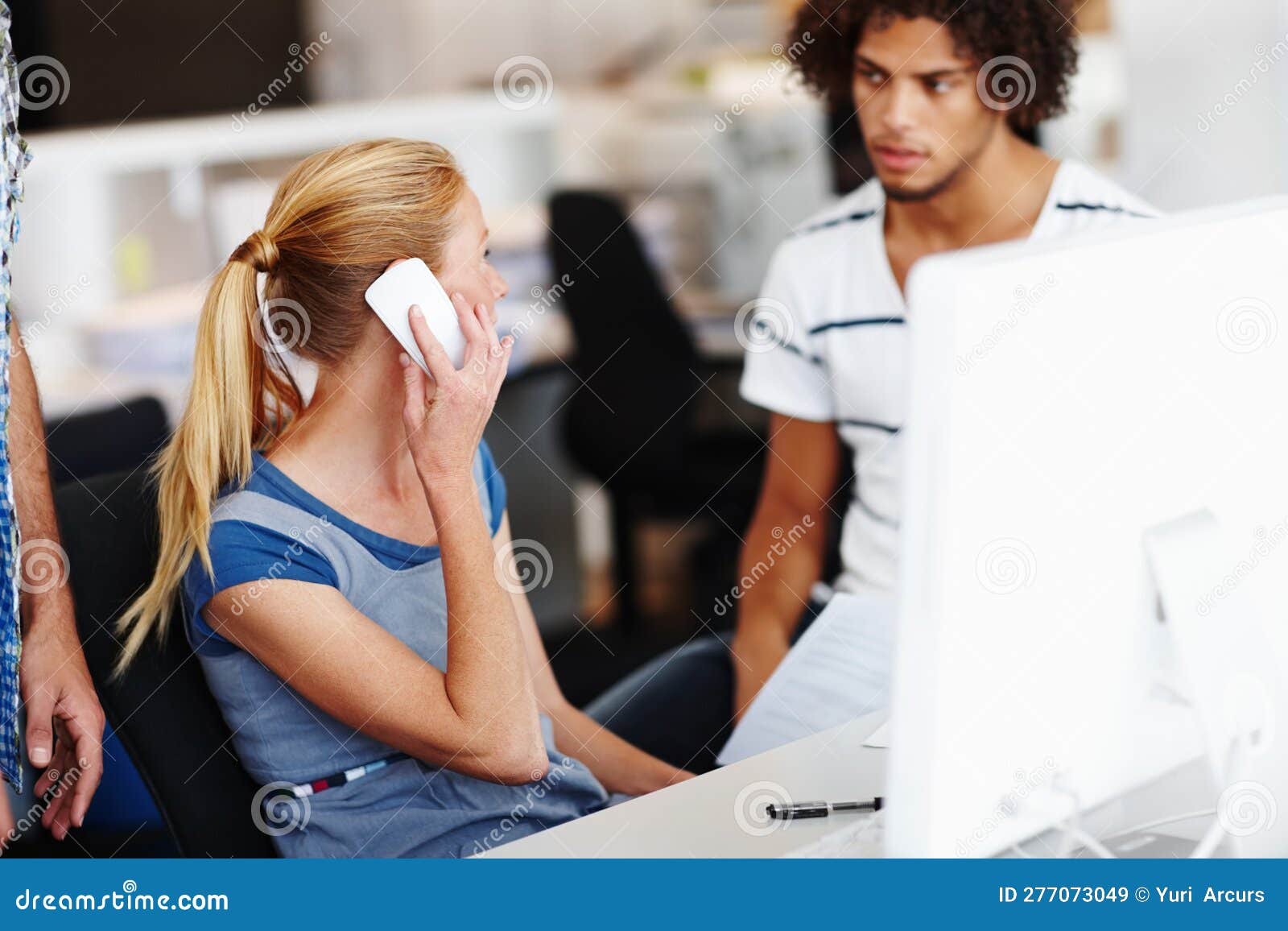 Talking To a Client. a Group of Colleagues Working in the Office ...