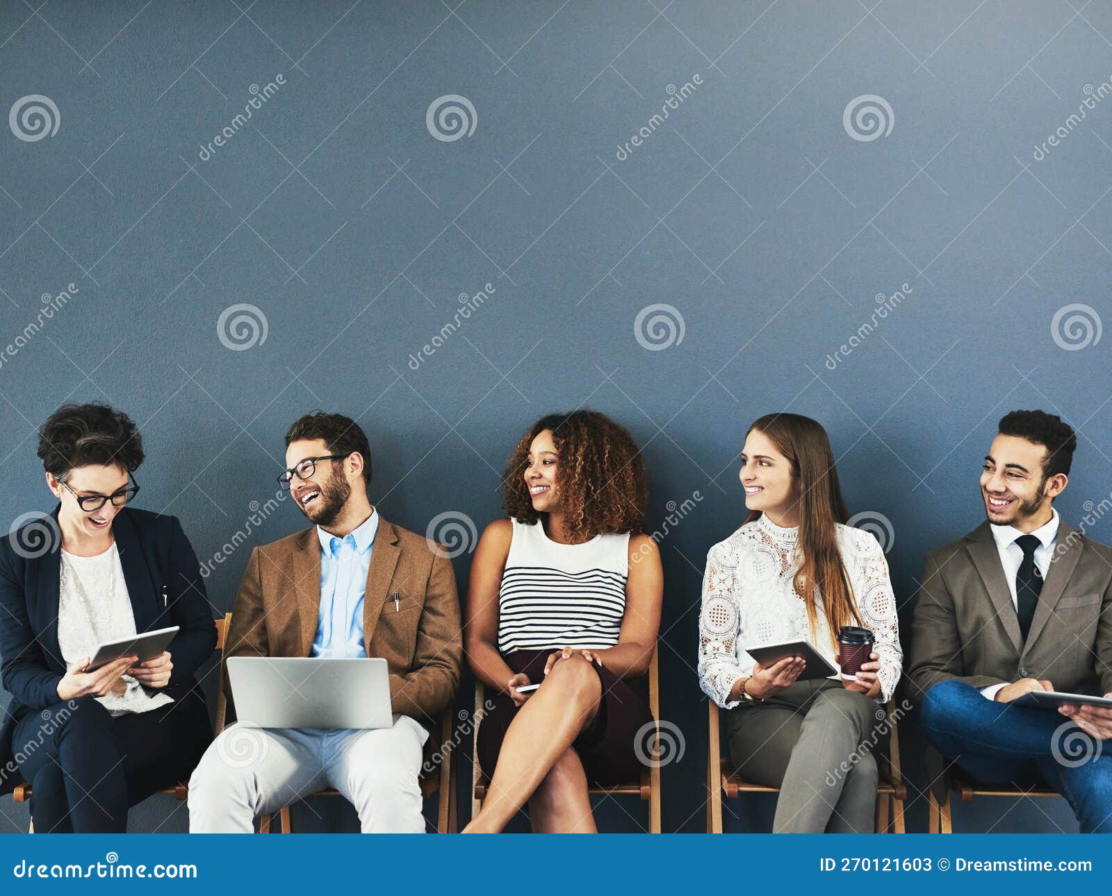 Talking To Pass the Time. Studio Shot of a Group of Businesspeople ...