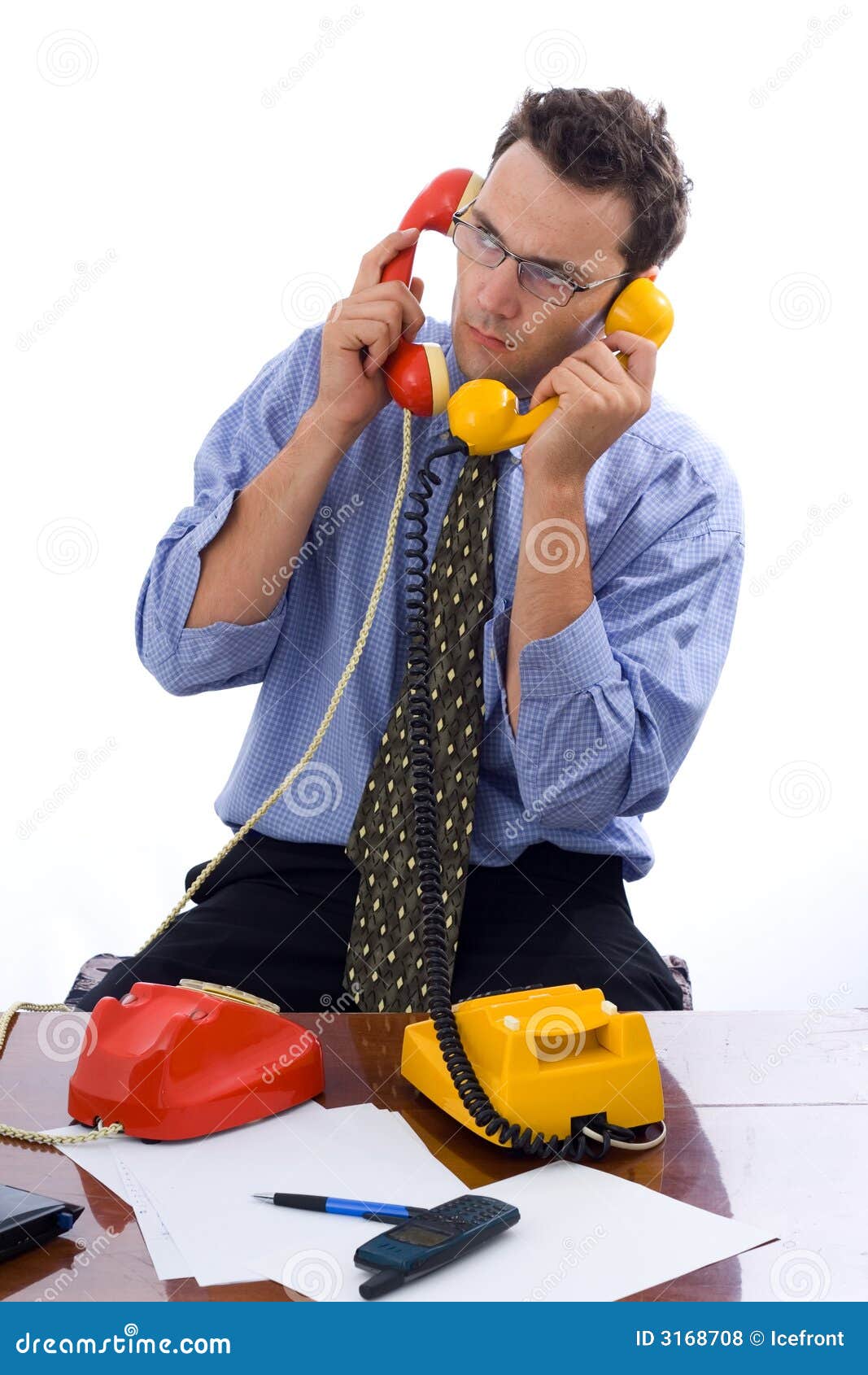 Talking on two telephones stock photo. Image of phone - 3168708
