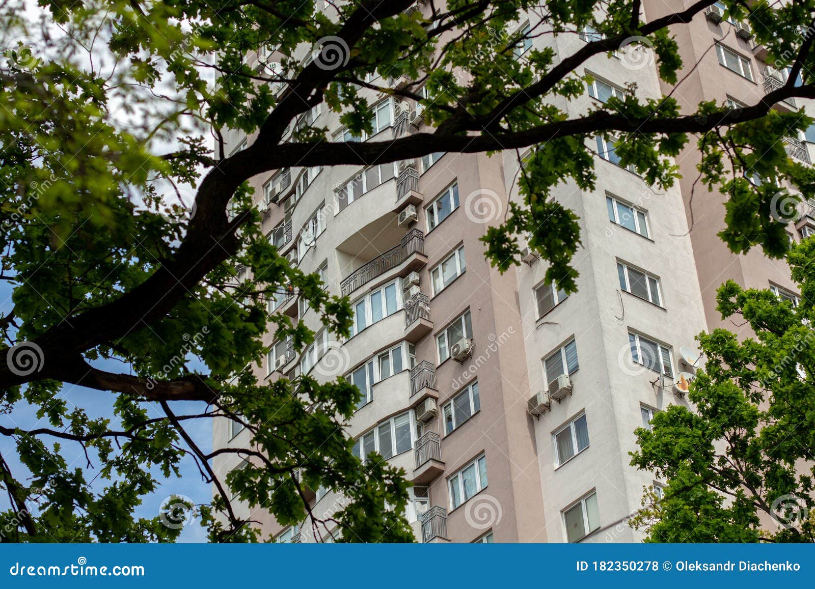 Tall Apartment Building among Trees Leaves Stock Photo - Image of ...