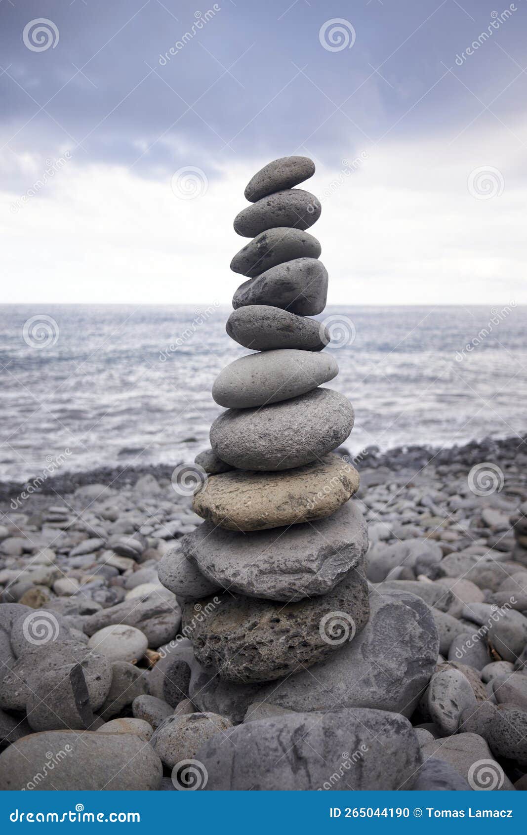 Tall Balanced Stack of Pebble Stones on a Stony Beach in Madeira Stock ...