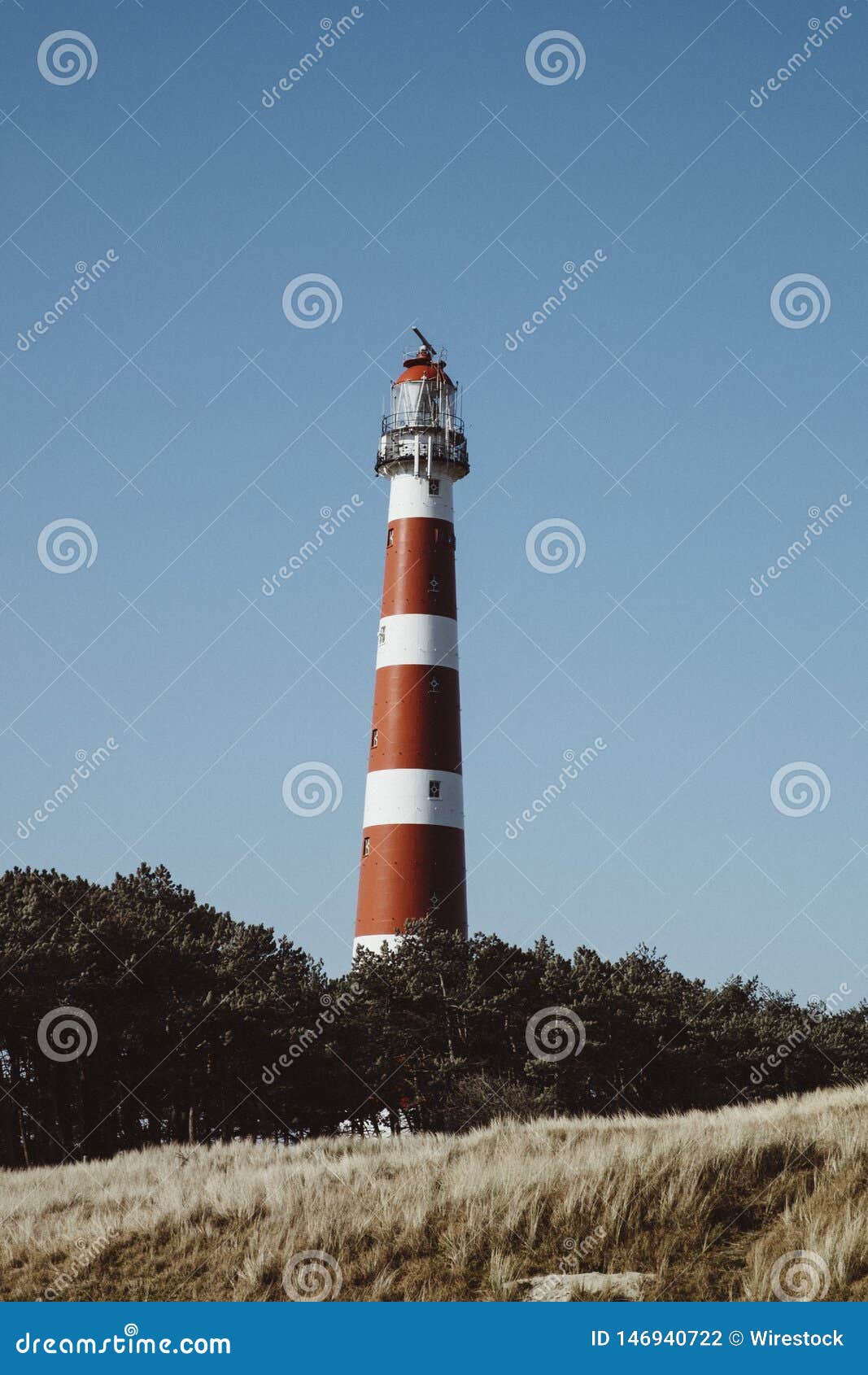 A tall beacon in the field stock photo. Image of architecture - 146940722