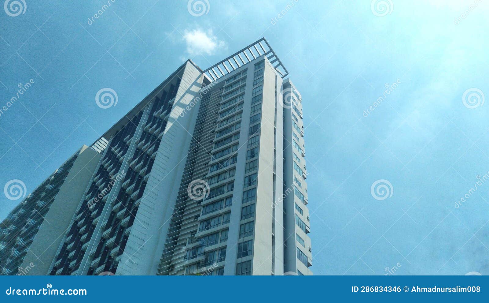 A Tall Building with a Bright and Beautiful Blue Sky As a Background ...