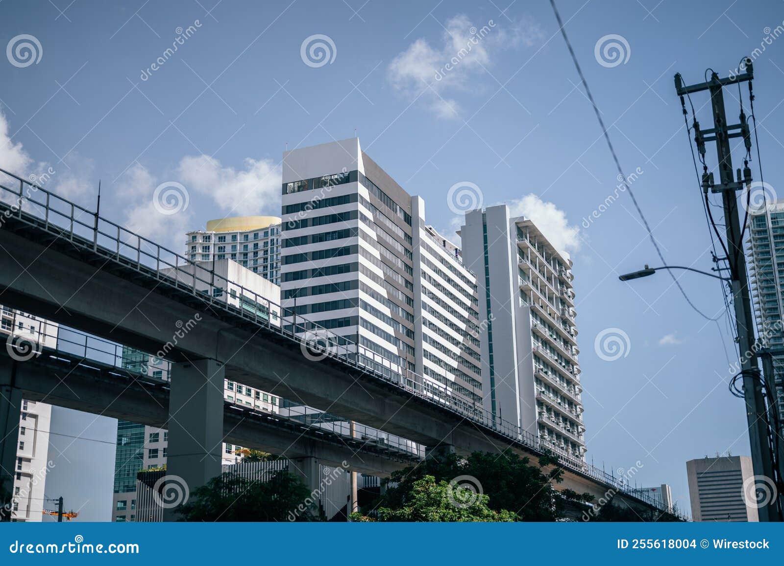 Tall Building with a Cloudy Sky Above Stock Photo - Image of building ...