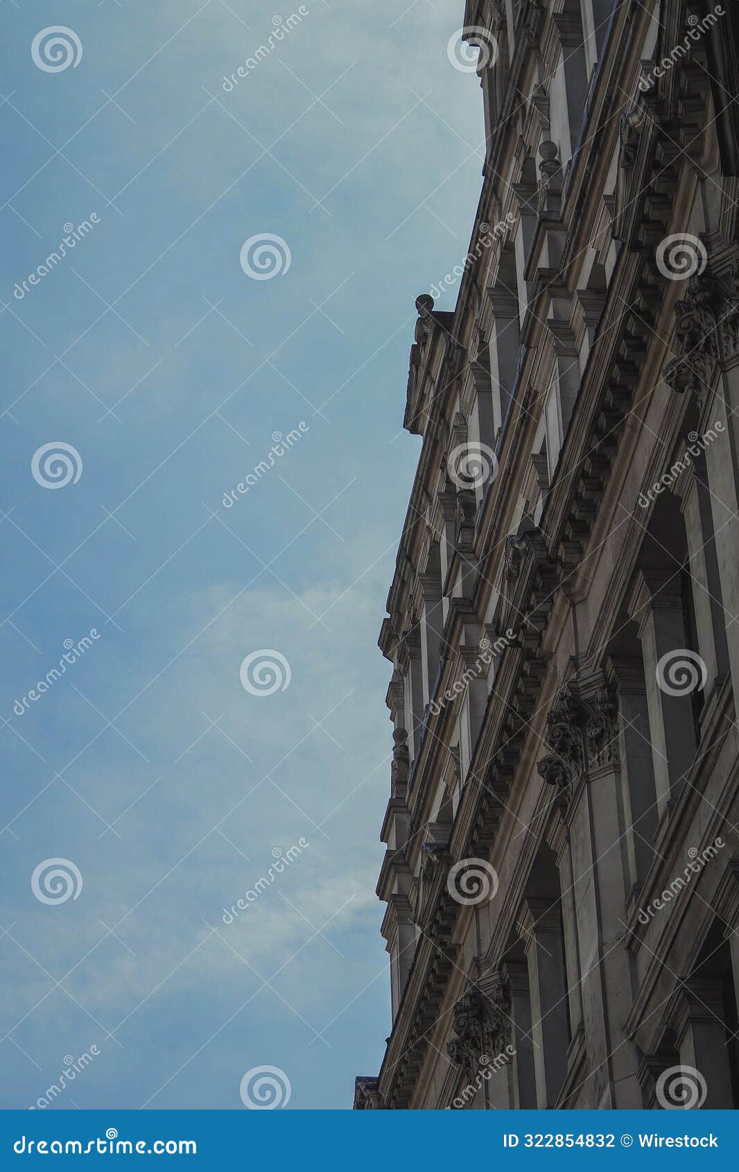 Tall Building Flanked by Decorative Pillars Stock Photo - Image of ...