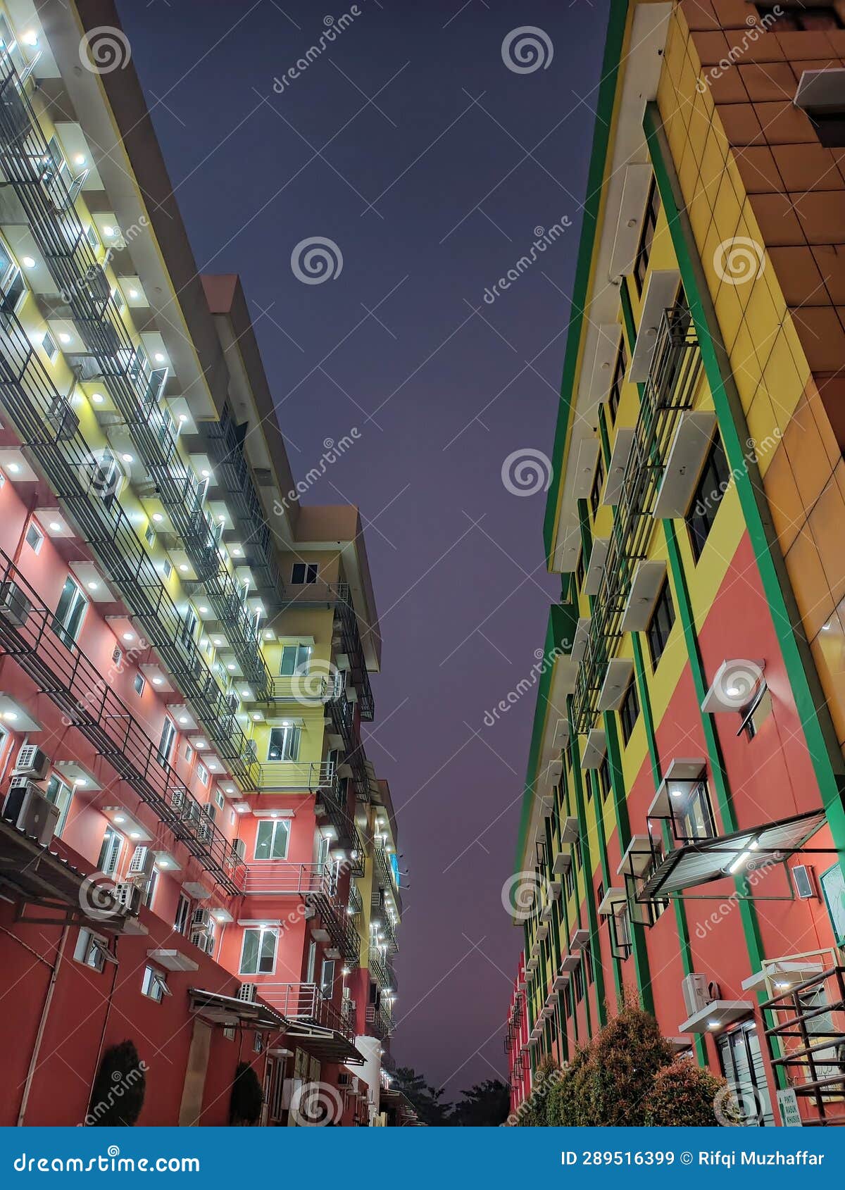 Tall building at midnight stock image. Image of background - 289516399