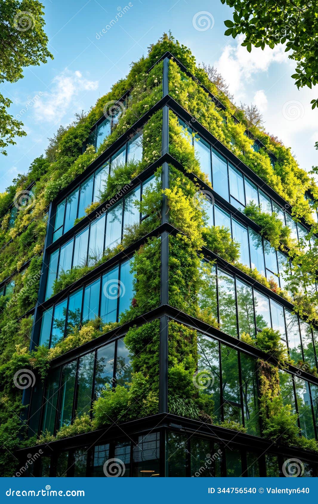 A Tall Building with Plants Growing on the Side of it Stock Photo ...