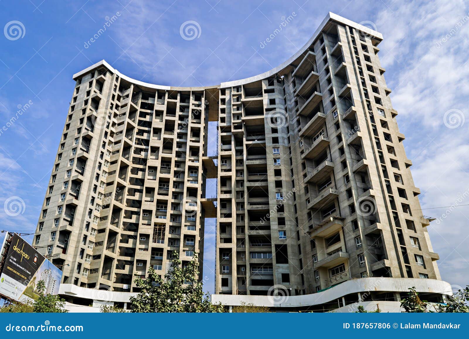 Tall Building Project Under Construction on a Background of Blue Sky ...