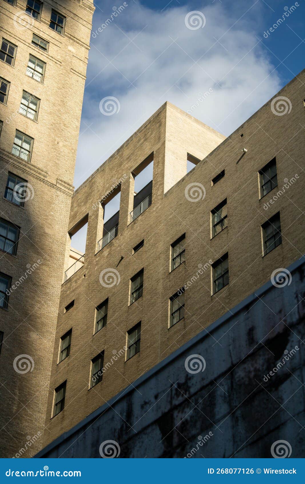 Tall Building Shadowed by Another Building Stock Photo - Image of ...