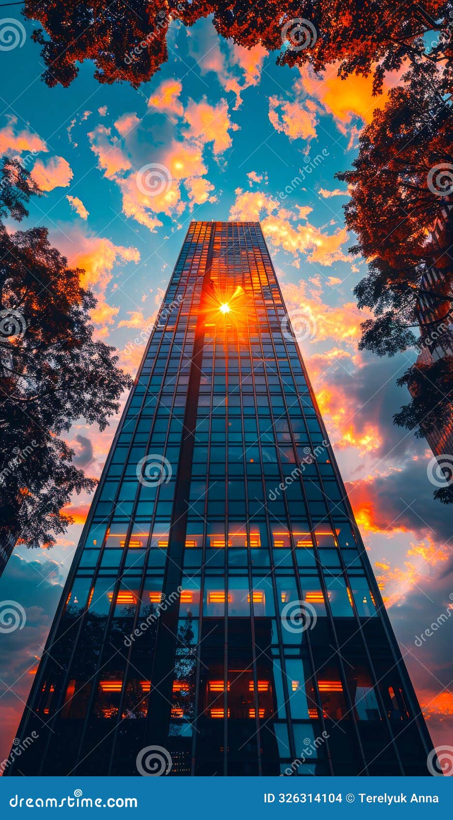 A Tall Building with a Sun Shining on it Stock Photo - Image of ...