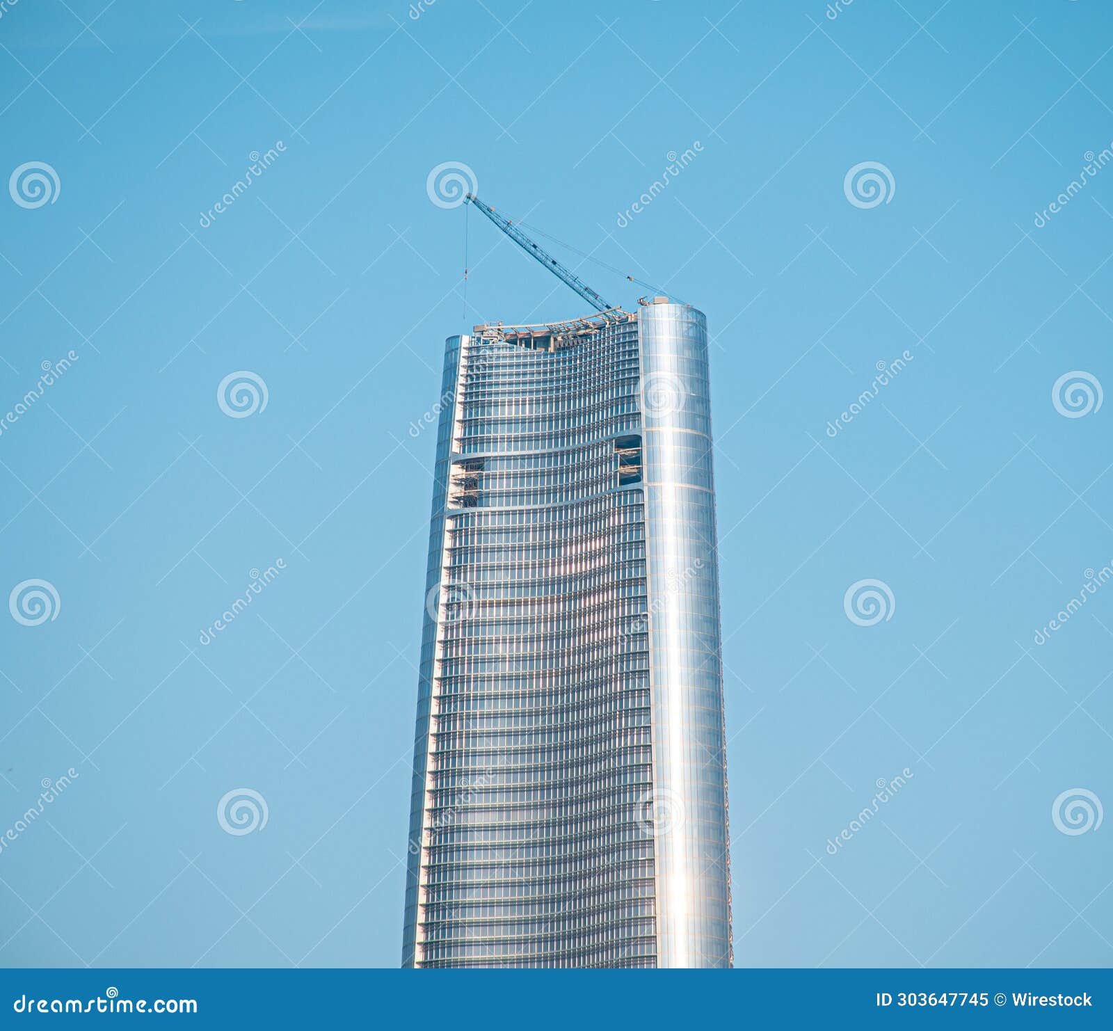 Tall Building with a Tower Reaching Up Towards it Stock Image - Image ...