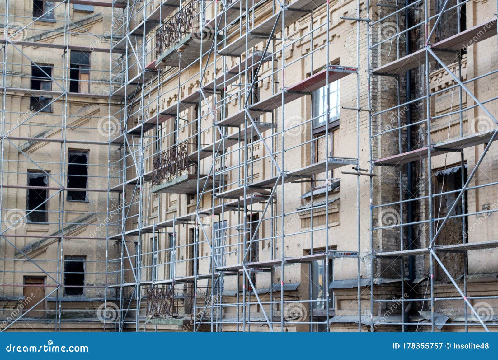 Tall Building Under Construction with Scaffolds. Scaffold. Construction ...