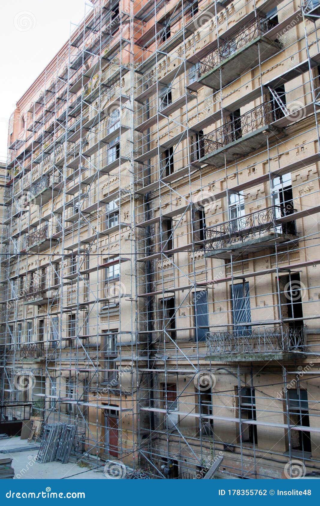 Tall Building Under Construction with Scaffolds. Scaffold. Construction ...