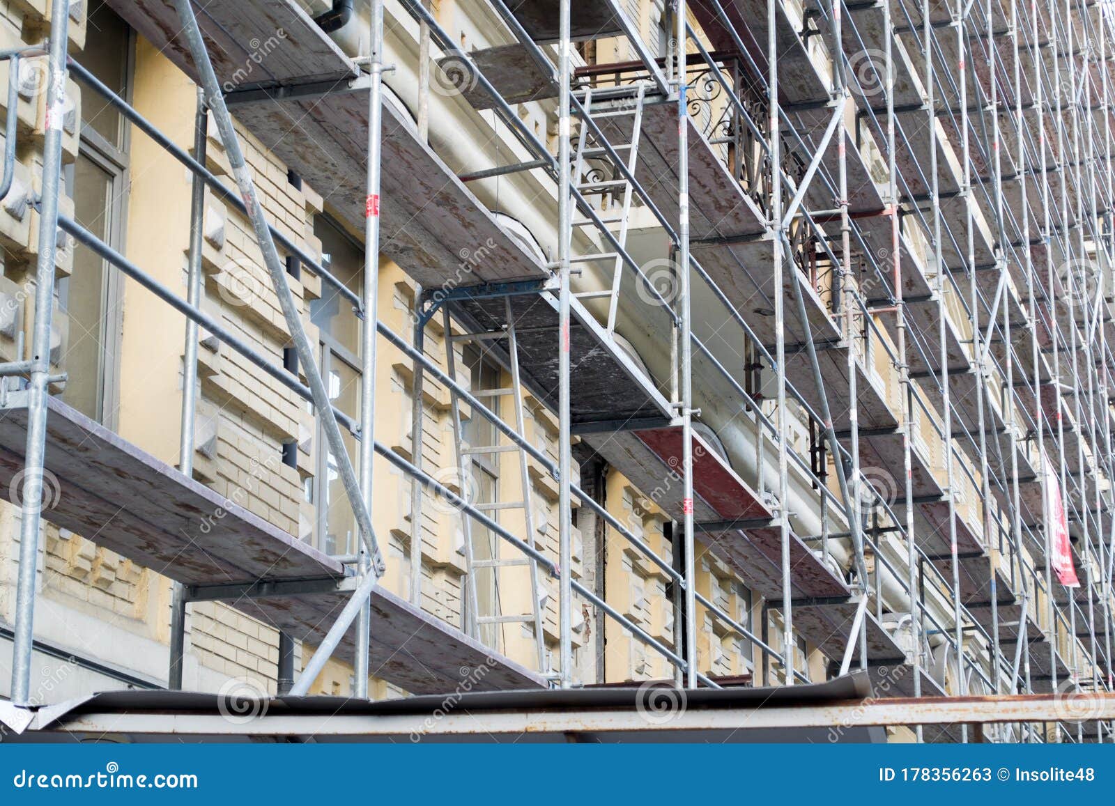 Tall Building Under Construction with Scaffolds. Stock Image - Image of ...
