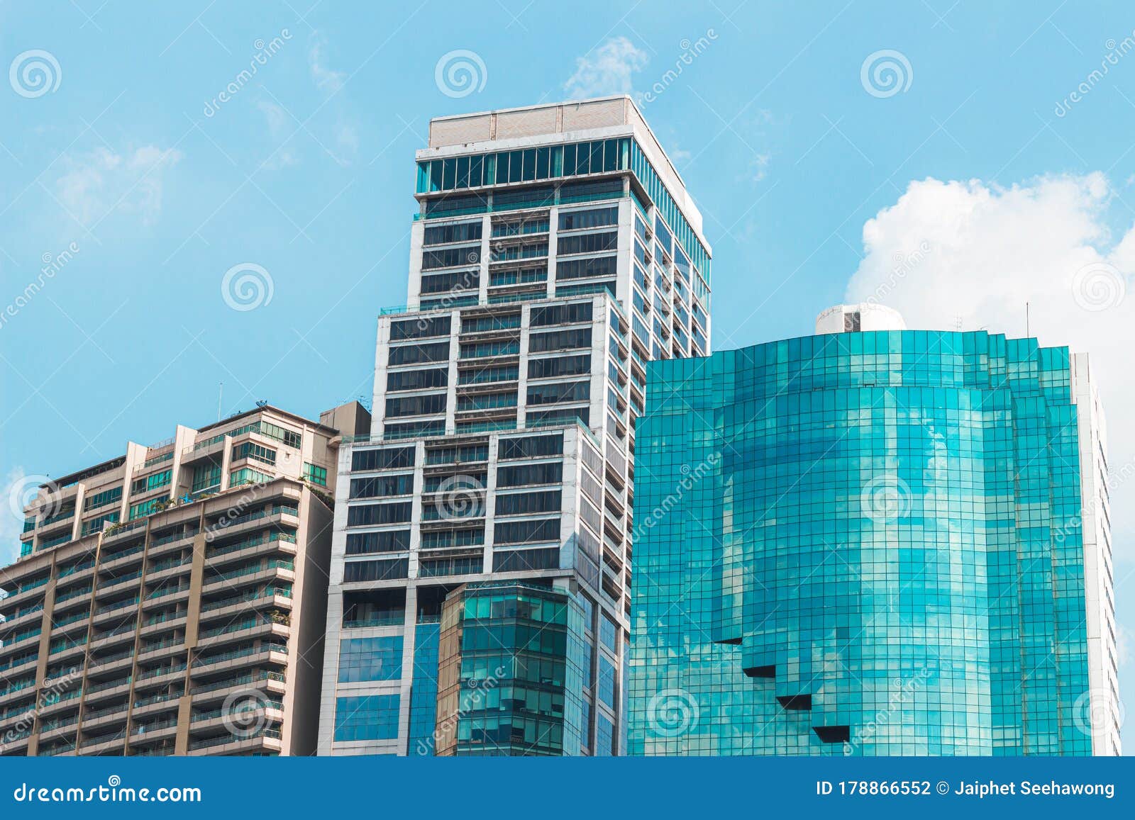3 Tall Buildings with Buildings in the Middle Higher Stock Photo ...