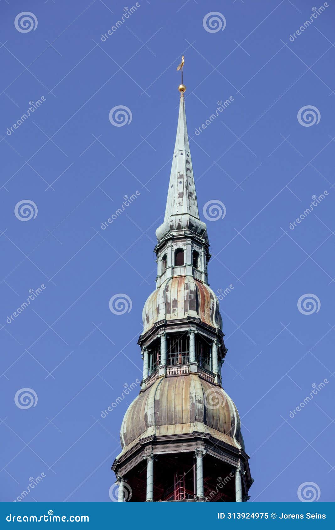 .a Tall Church Tower with a Gilded Rooster at the Top of the Tower ...