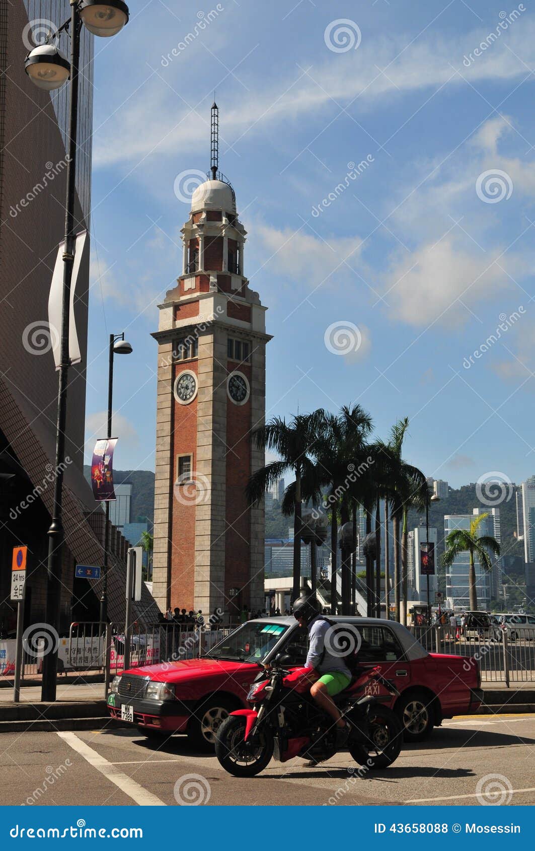 Tall Clock Tower Of The Victorian Atkinson Building Against A Blue ...