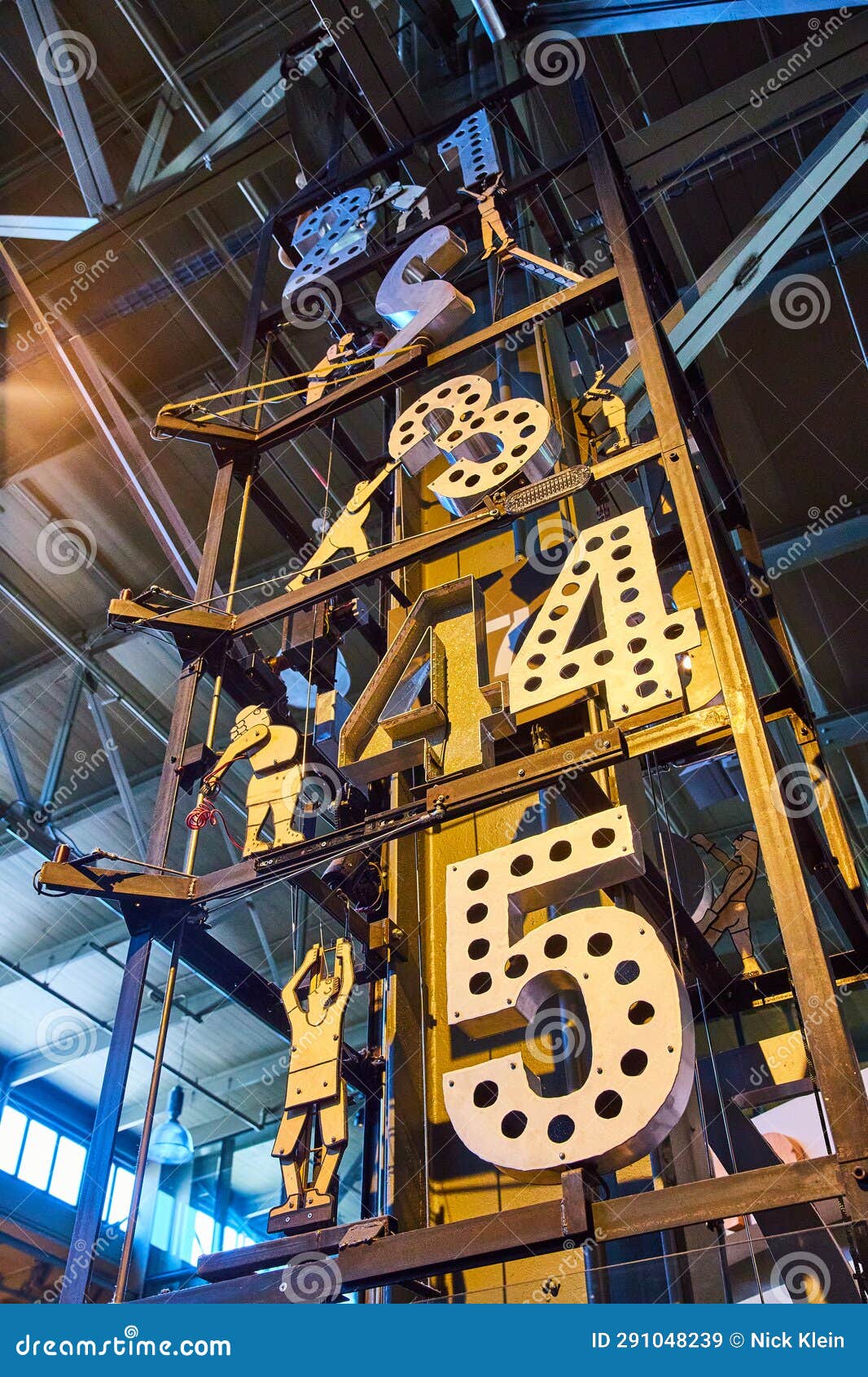 Tall Clock Tower with Mechanical People Moving Numbers One through Five ...