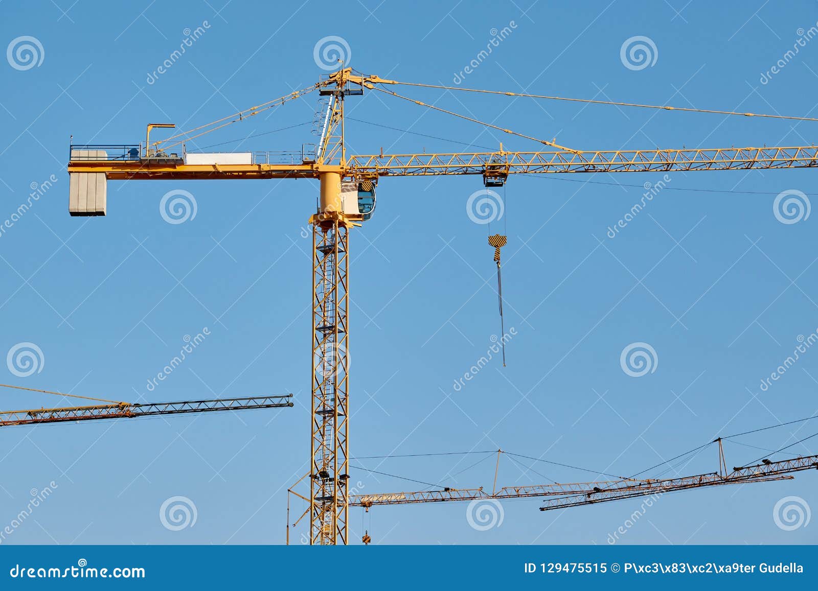 Tall Construction Cranes stock image. Image of city - 129475515