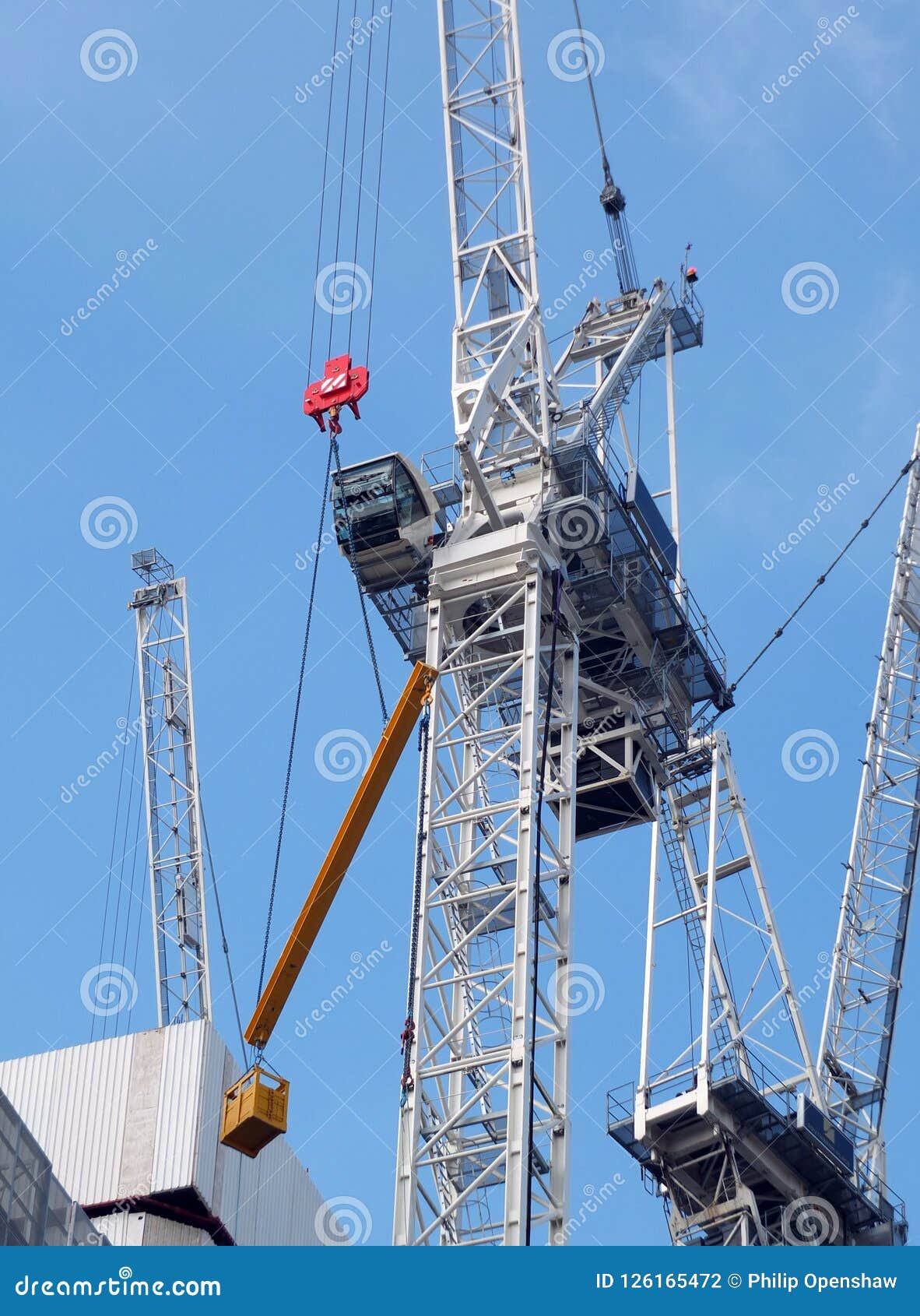 Tall Construction Cranes Working on a Large Development Site with ...