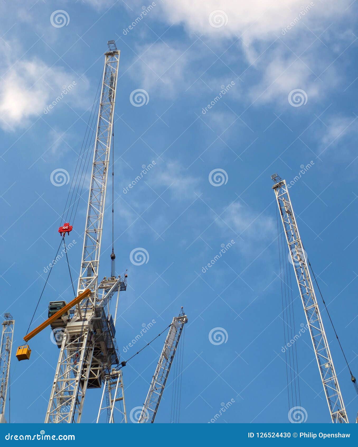 Tall Construction Cranes Working on a Large Development Site with ...