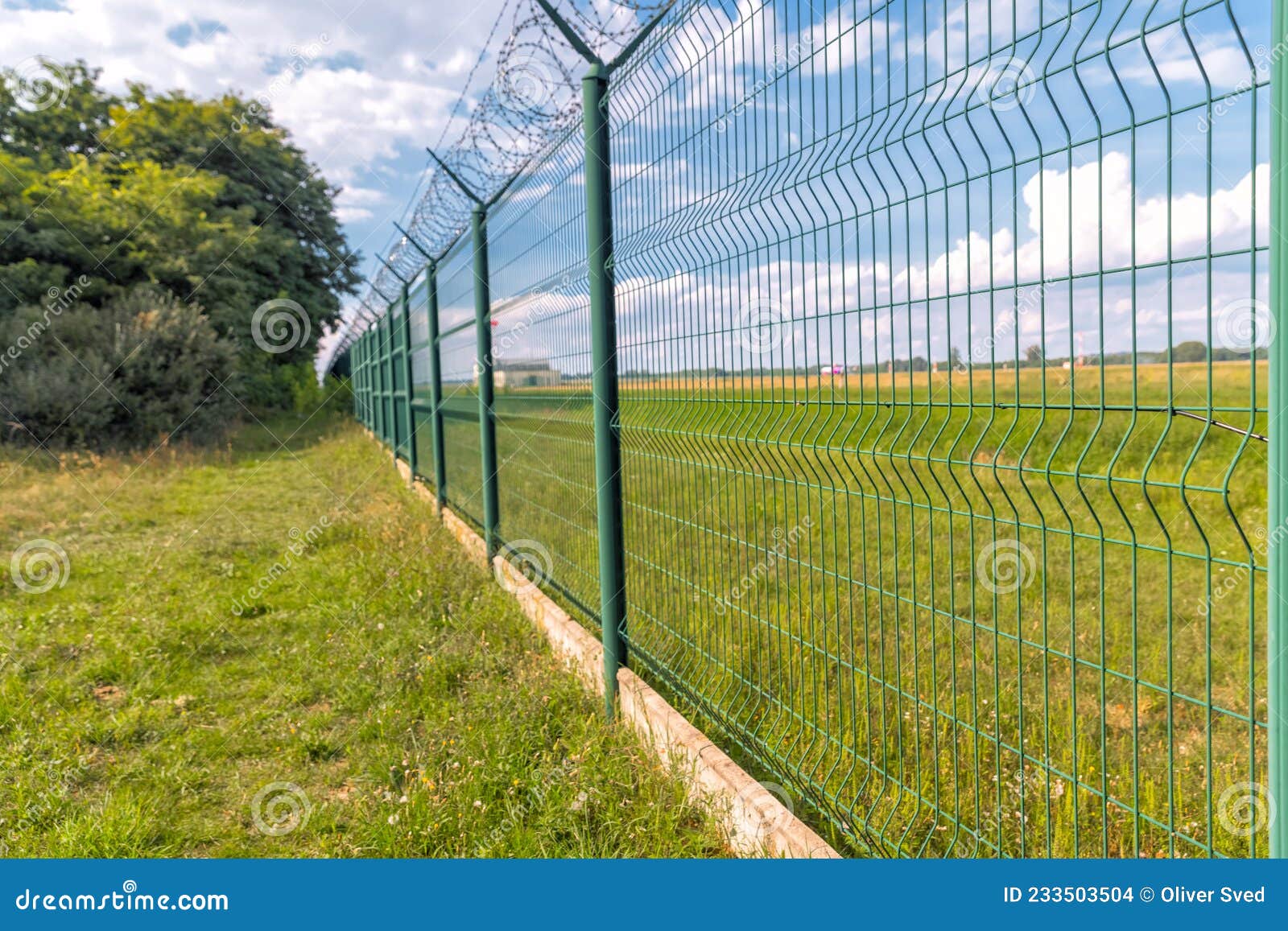 Tall Fence with Barbed Wire Angle Shot Stock Photo - Image of military ...