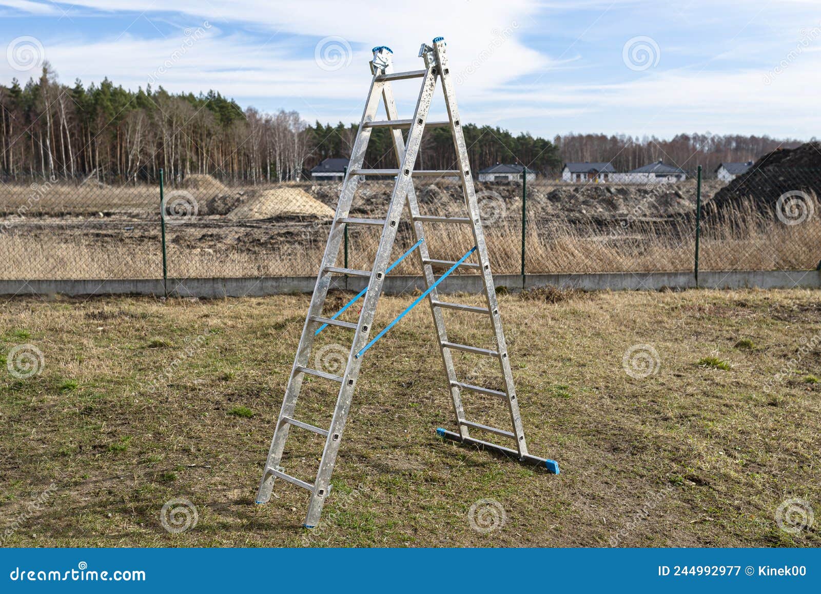 A Tall, Fold-out Aluminum Ladder Standing in the Yard, in the Shape of ...