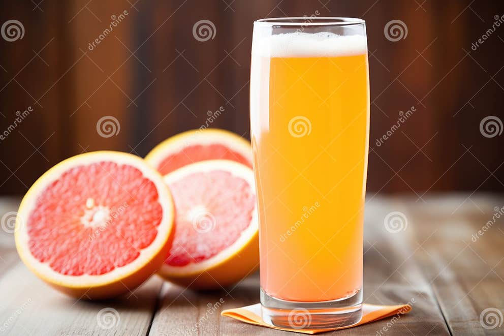 A Tall Glass of Grapefruit Beer with a Grapefruit Slice Stock Photo ...