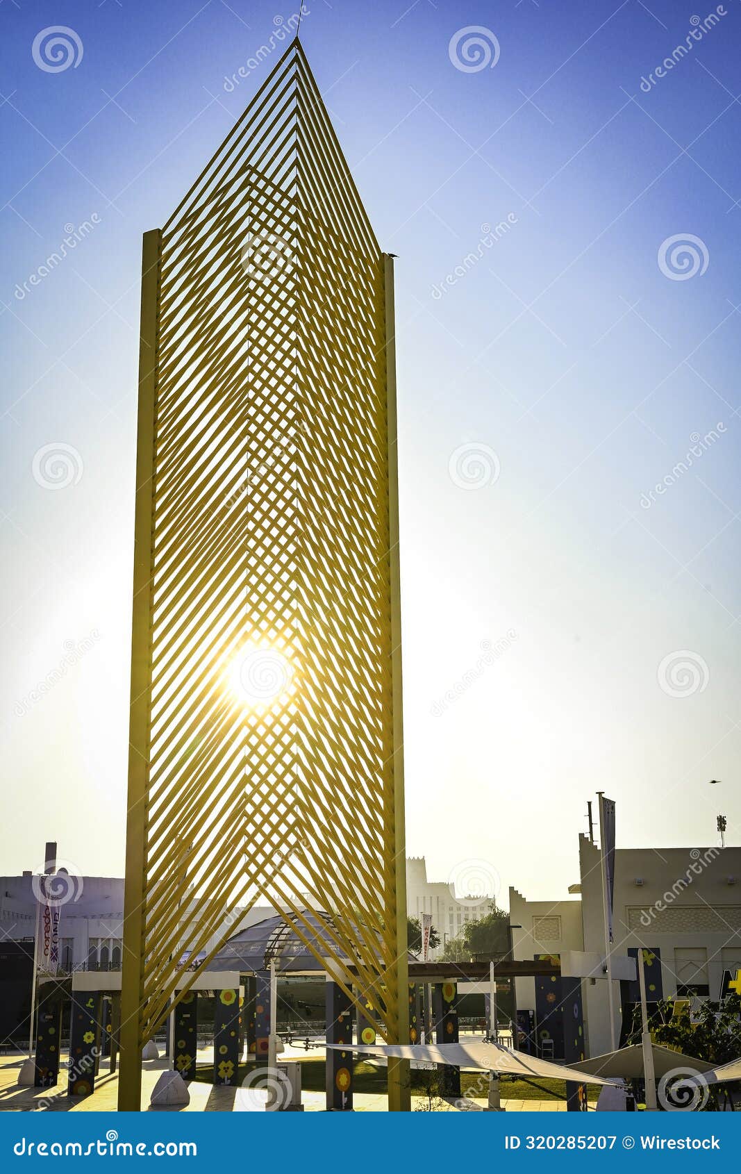Tall Golden Structure Amidst Green Grass Stock Image - Image of ornate ...