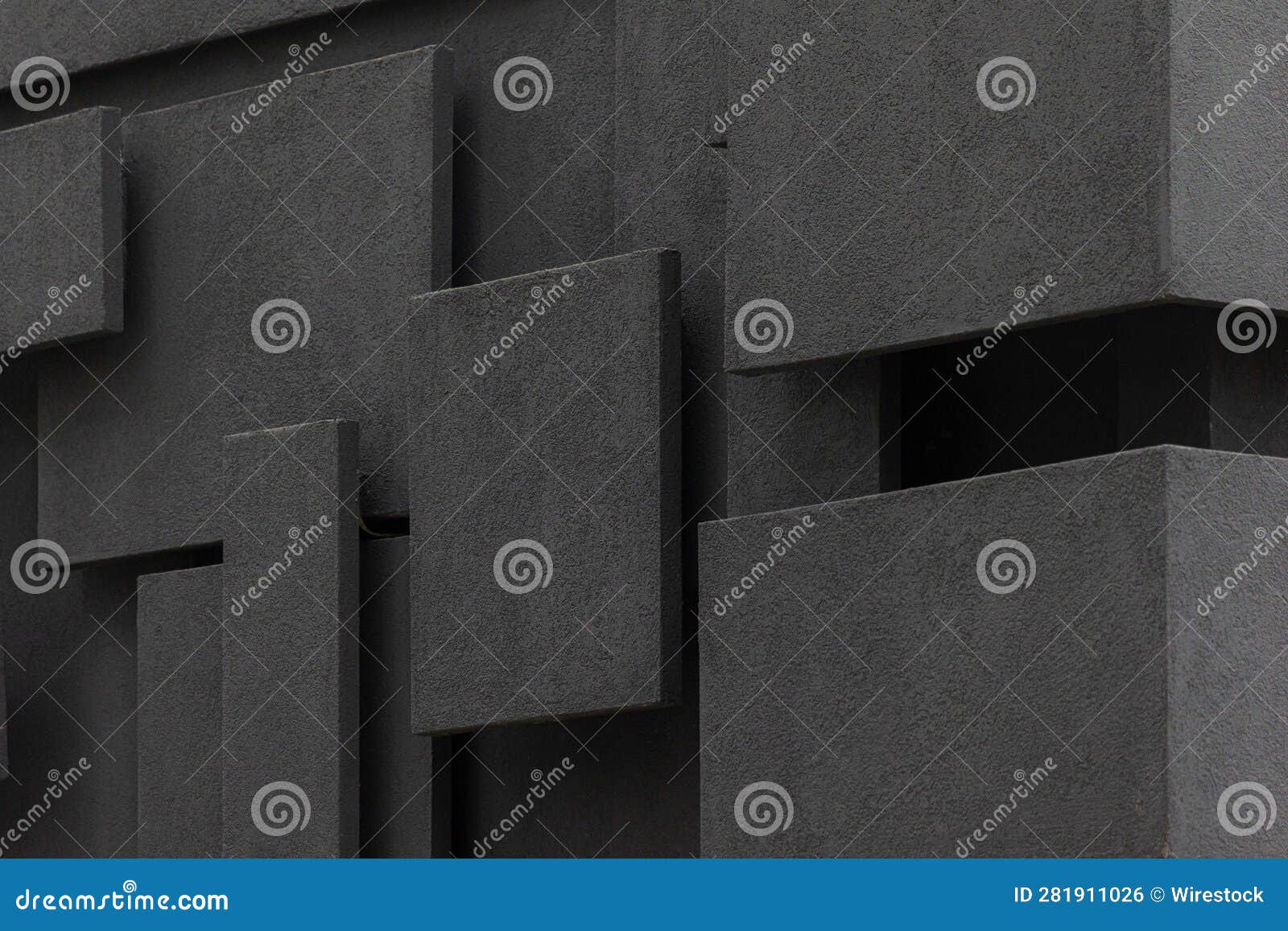 A Tall Gray Building with Square Openings at the Top and One Window ...