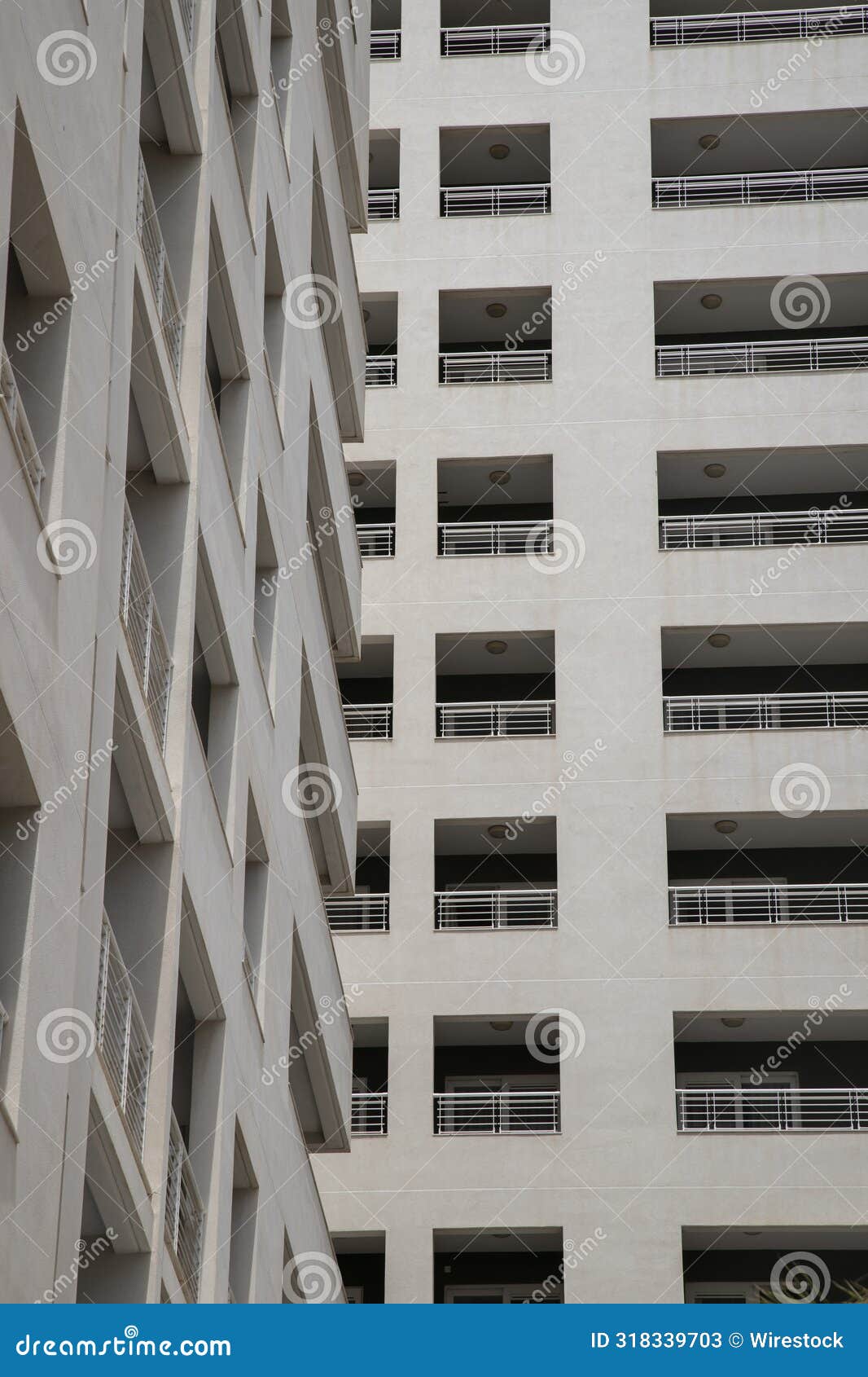 A Tall Gray Building with Balconies on Each Floor Stock Image - Image ...